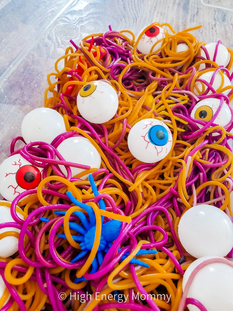 Halloween Spaghetti and Eyeballs Sensory Bin • High Energy Mommy